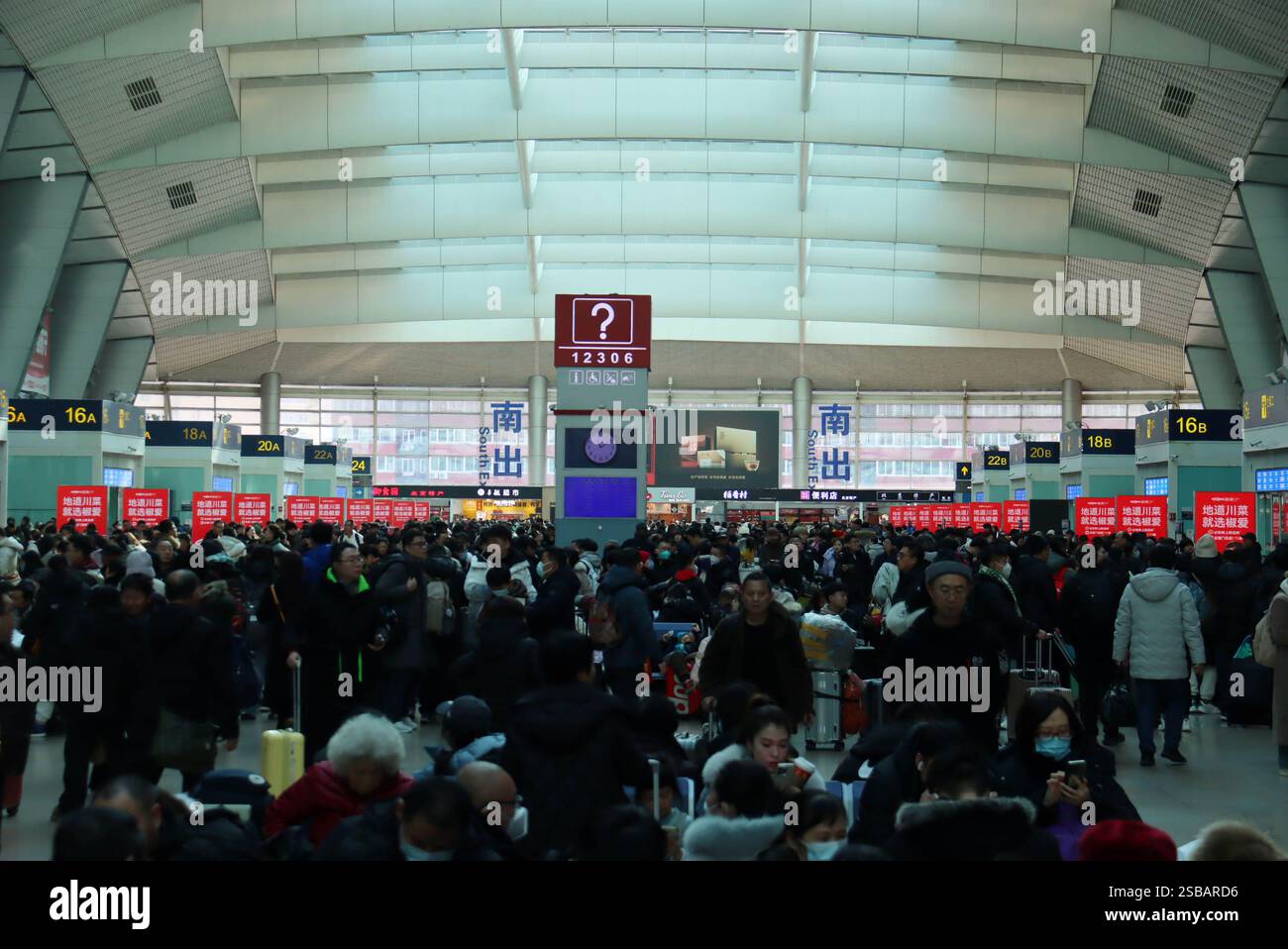 BEIJING, CHINA - FEBRUARY 2, 2025 - Passengers prepare to take a train ...