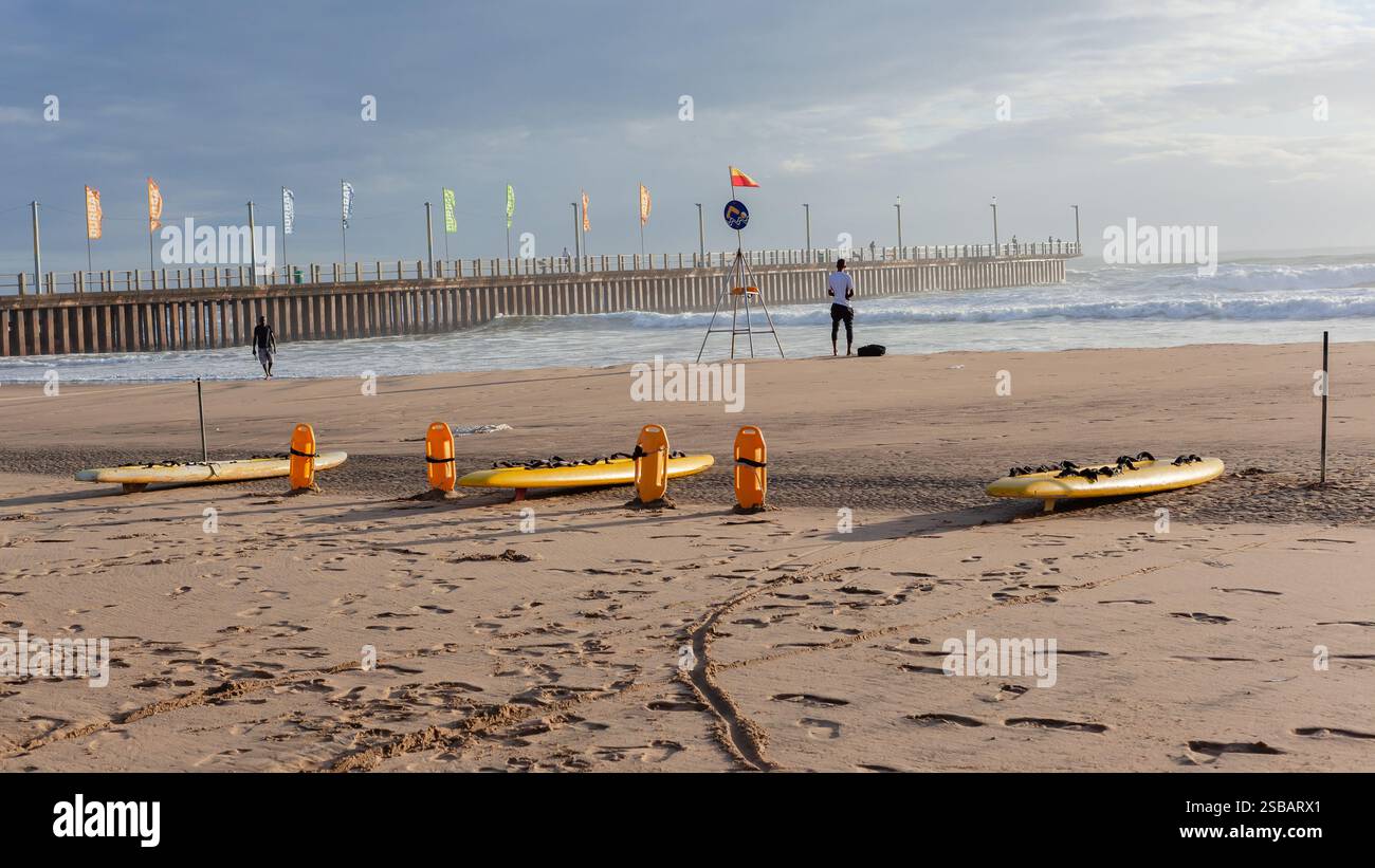 Lifeguard rescue paddle boards and swimming bouys on beach waters edge ...