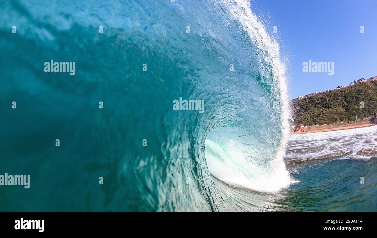 Ocean wave hollow tube crashing water lip a close up swimming surfing ...