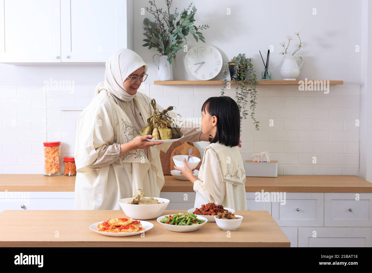 Mom and Kids Preparing ketupat Lebaran for Eid Al Fitr Muslim Hari Raya Celebration Stock Photo ...