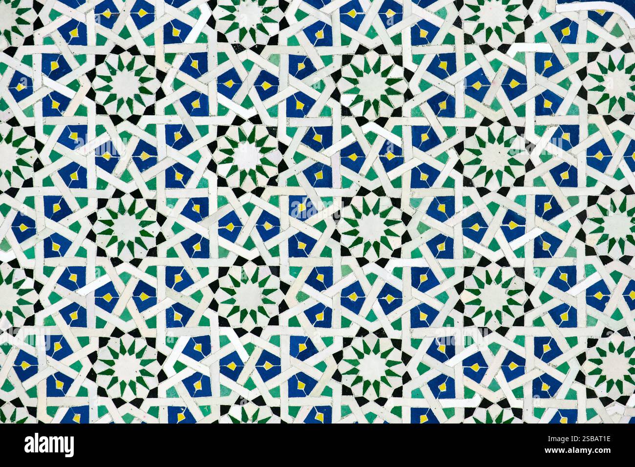 A detailed Islamic geometric mosaic featuring vibrant colors and ...