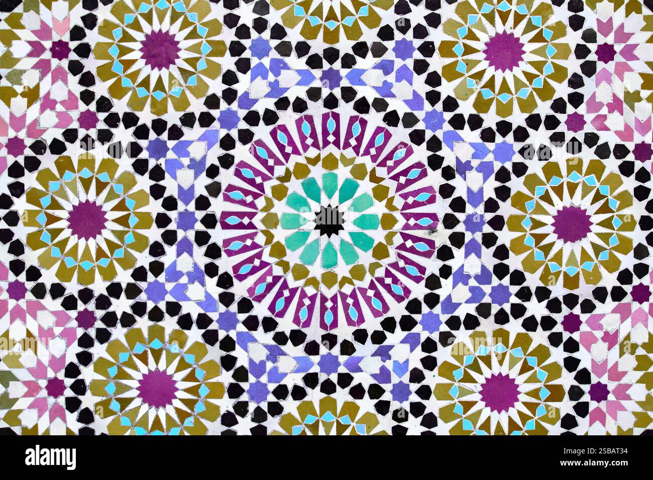 A detailed Islamic geometric mosaic featuring vibrant colors and ...