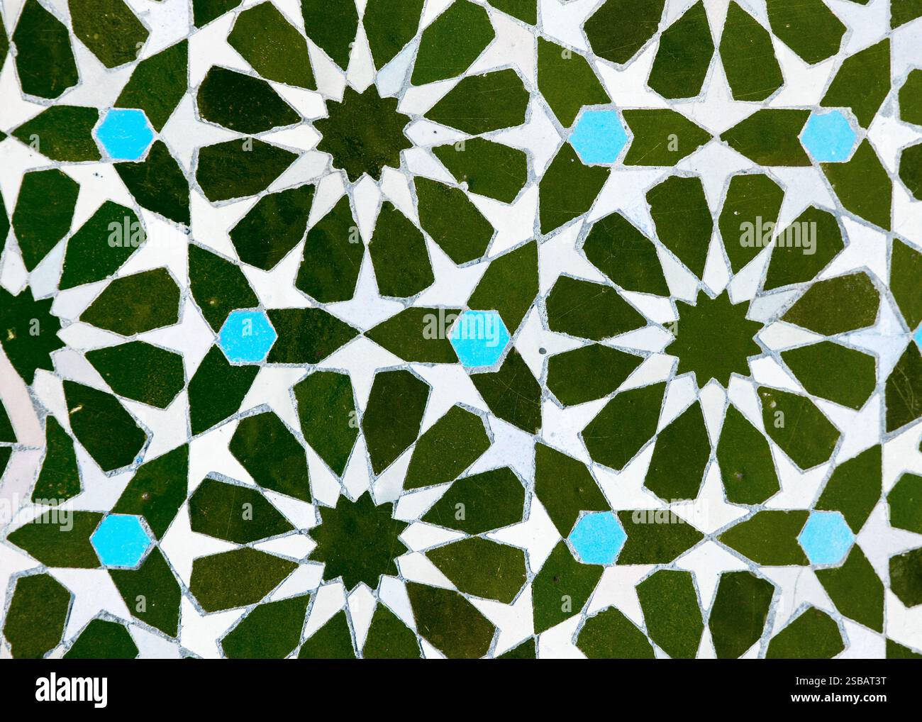 A detailed Islamic geometric mosaic featuring vibrant colors and ...