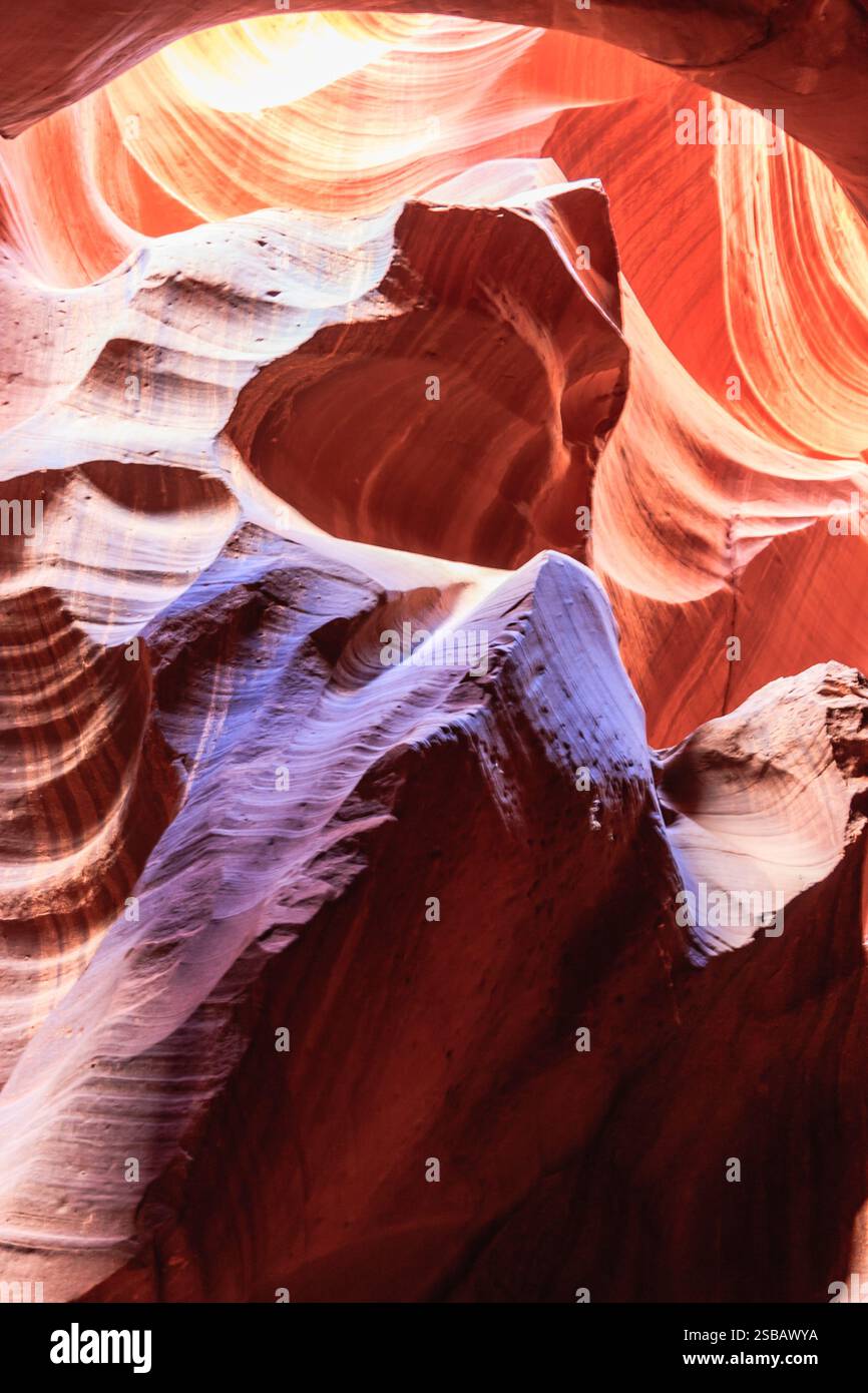 A canyon with a blue and white rock wall. The canyon is very deep and ...