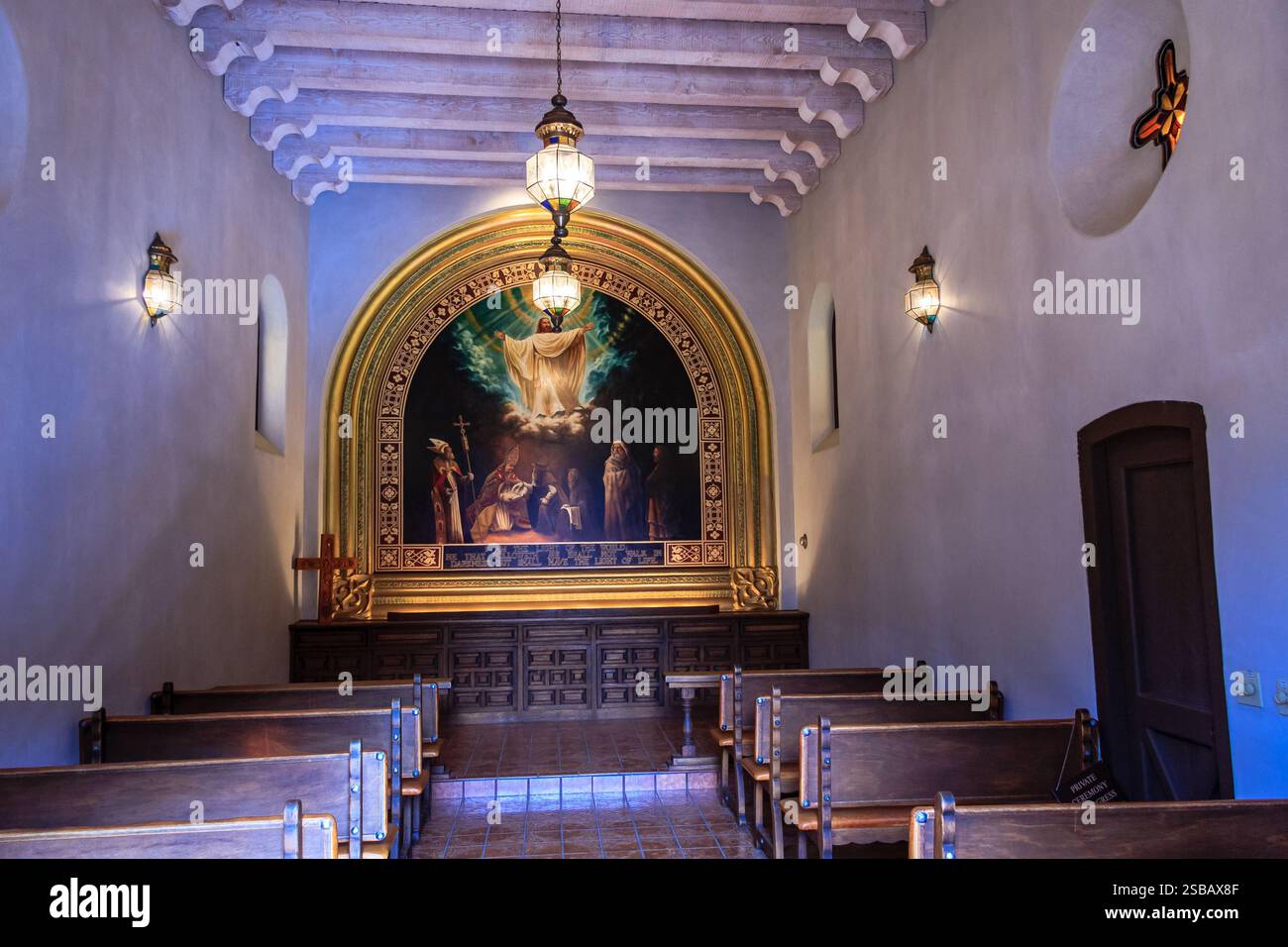 A church with a painting of the Last Supper on the wall. The painting ...