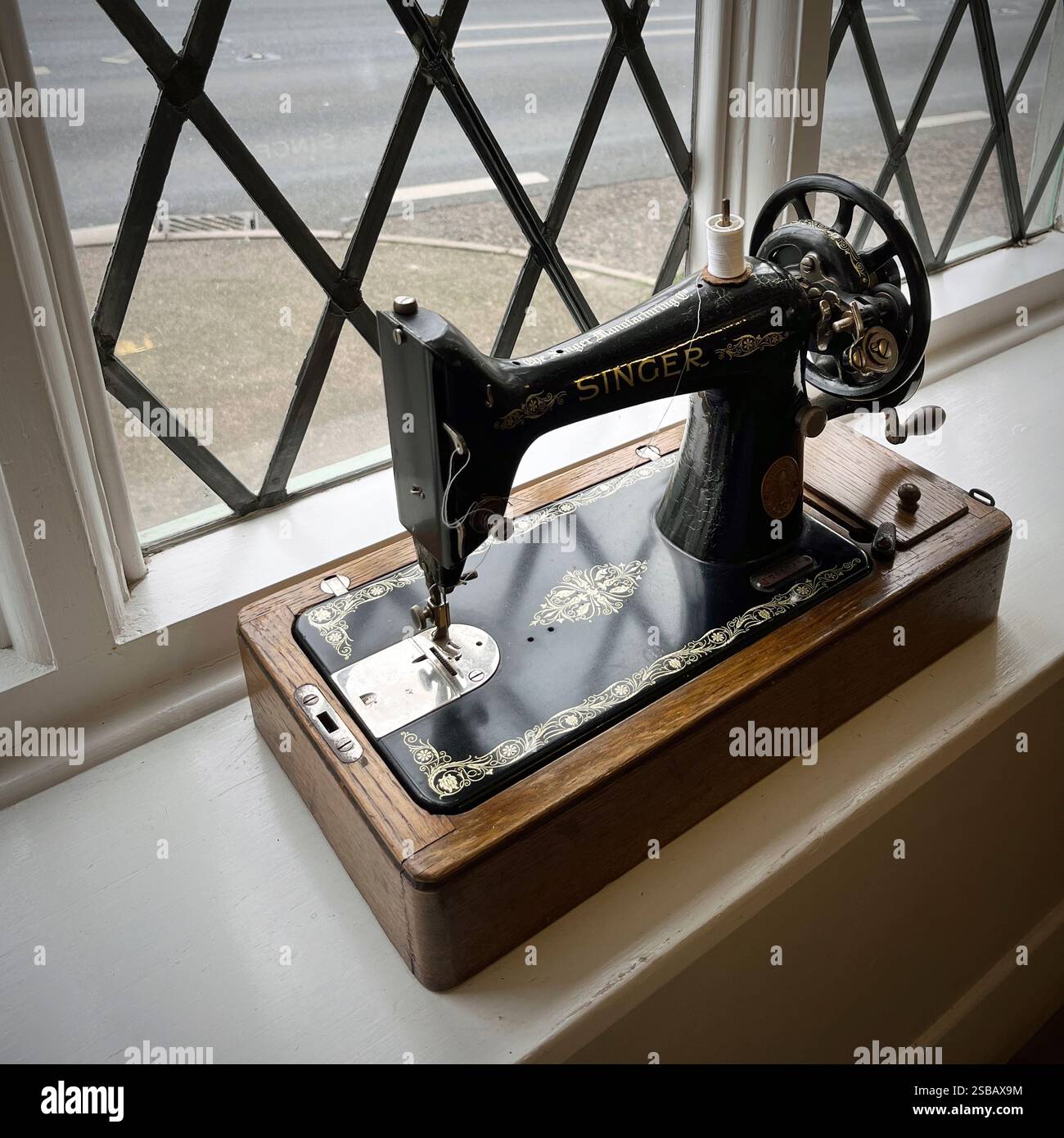 vintage sewing machine on cottage window cill, suffolk, england Stock ...
