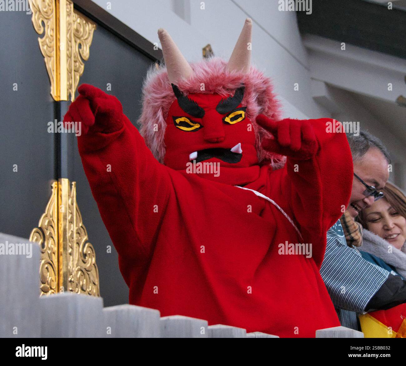 Tokyo, Japan. 02nd Feb, 2025. People dressed a demon throw beans during ...
