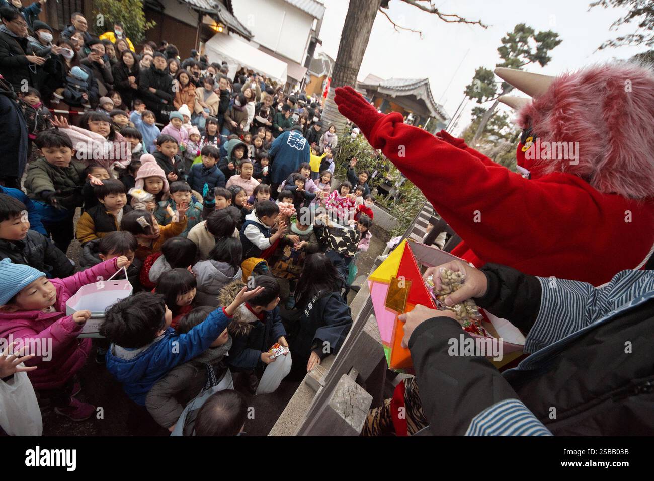 Tokyo, Japan. 02nd Feb, 2025. Children try to catch bags containing ...