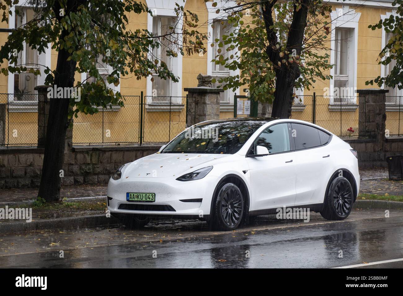 TOKAJ, HUNGARY - OCTOBER 27, 2023: White Tesla Model Y electric SUV car ...