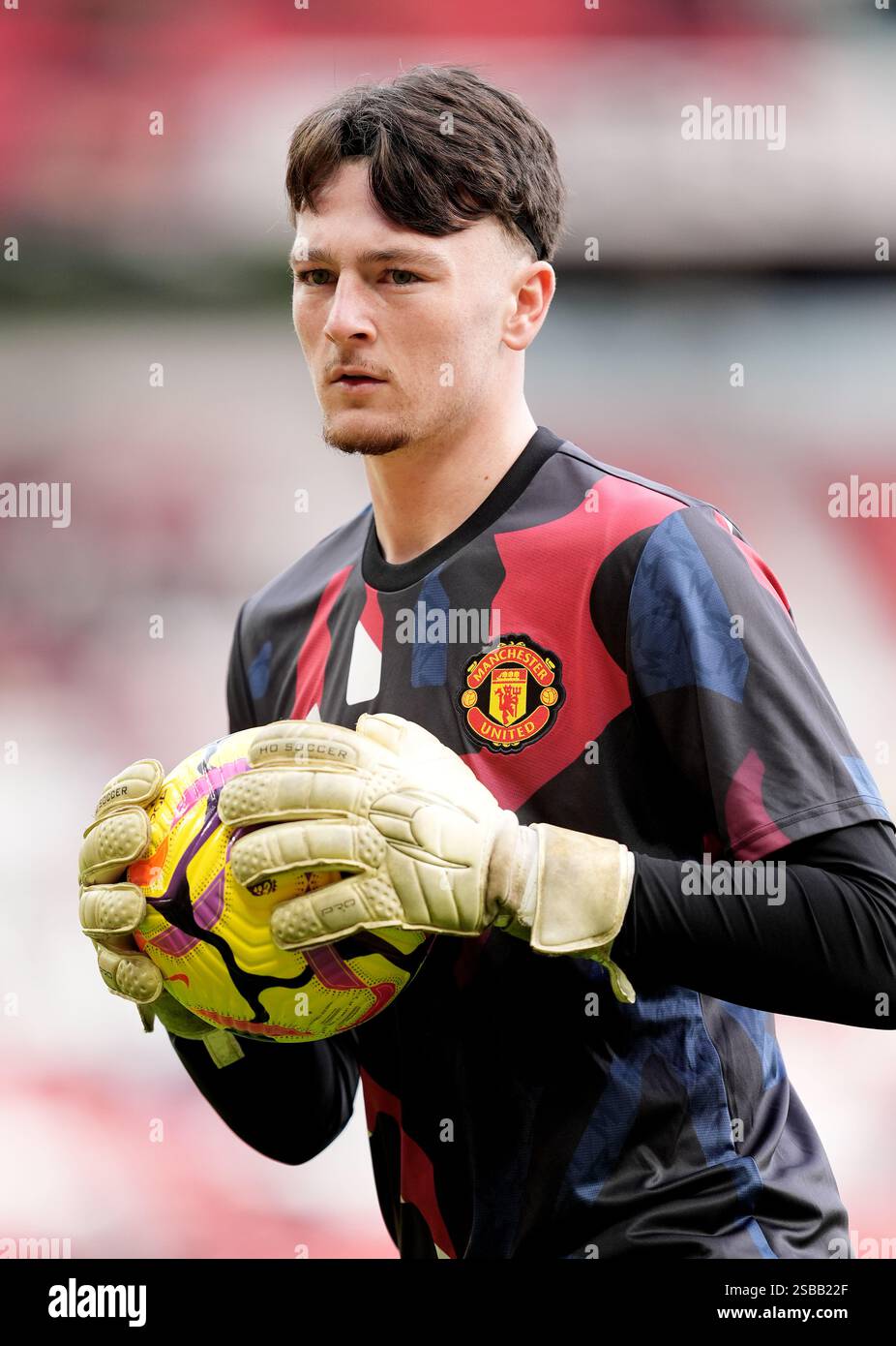 Manchester United goalkeeper Elyh Harrison warms up ahead of the ...