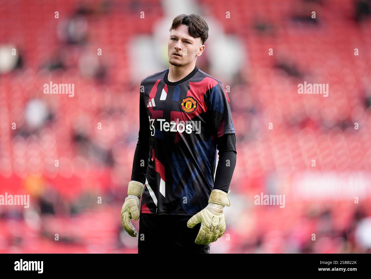 Manchester United goalkeeper Elyh Harrison warms up ahead of the ...