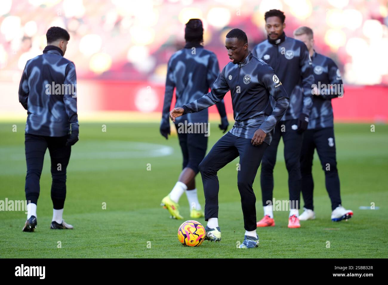 Brentford's Michael Kayode warms up before the Premier League match at ...