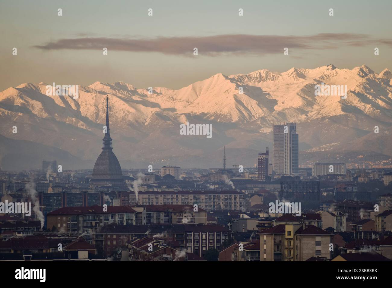Turin, surrounded by the Alps, early in the myst of the morning. The ...