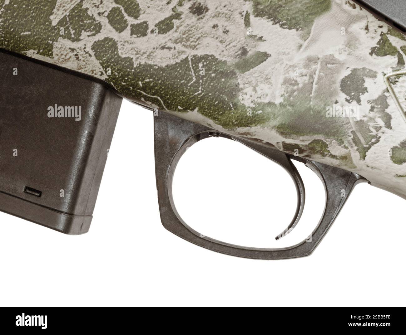 Bolt action rifle with a camouflage stock in a closeup of its ...