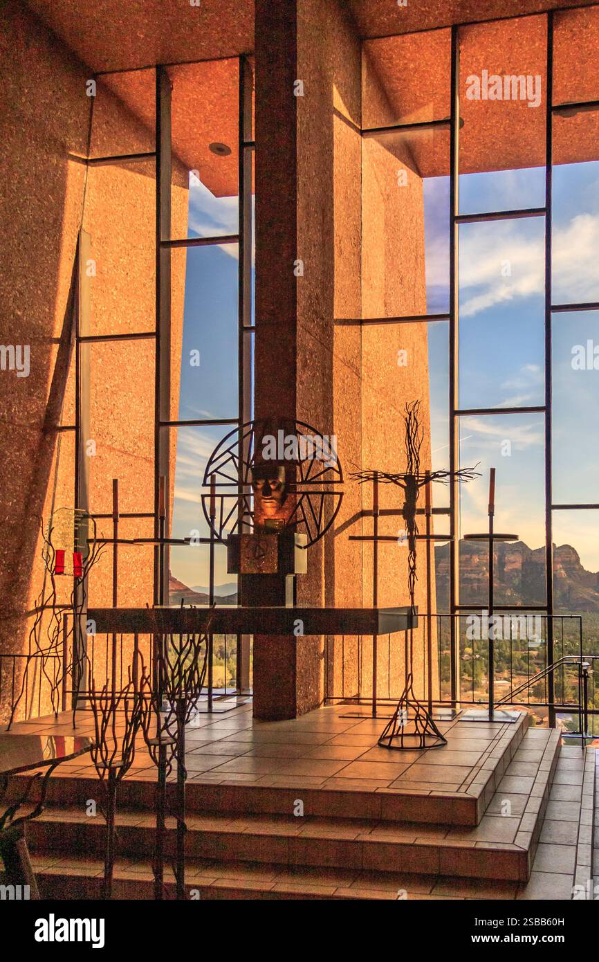 A church altar with a cross on it. The altar is in a building with a ...