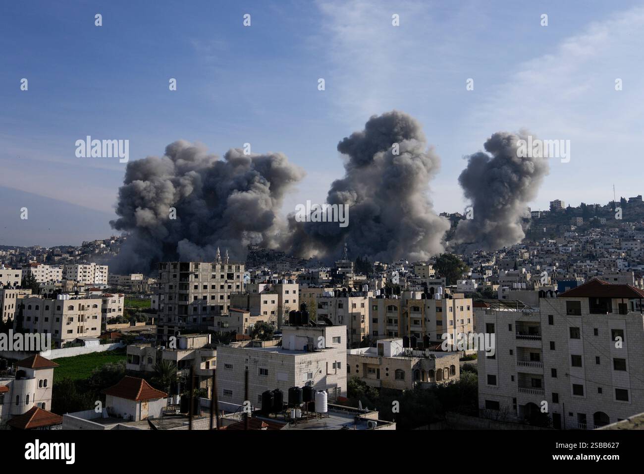 Smoke rises following an explosion detonated by the Israeli army, which ...