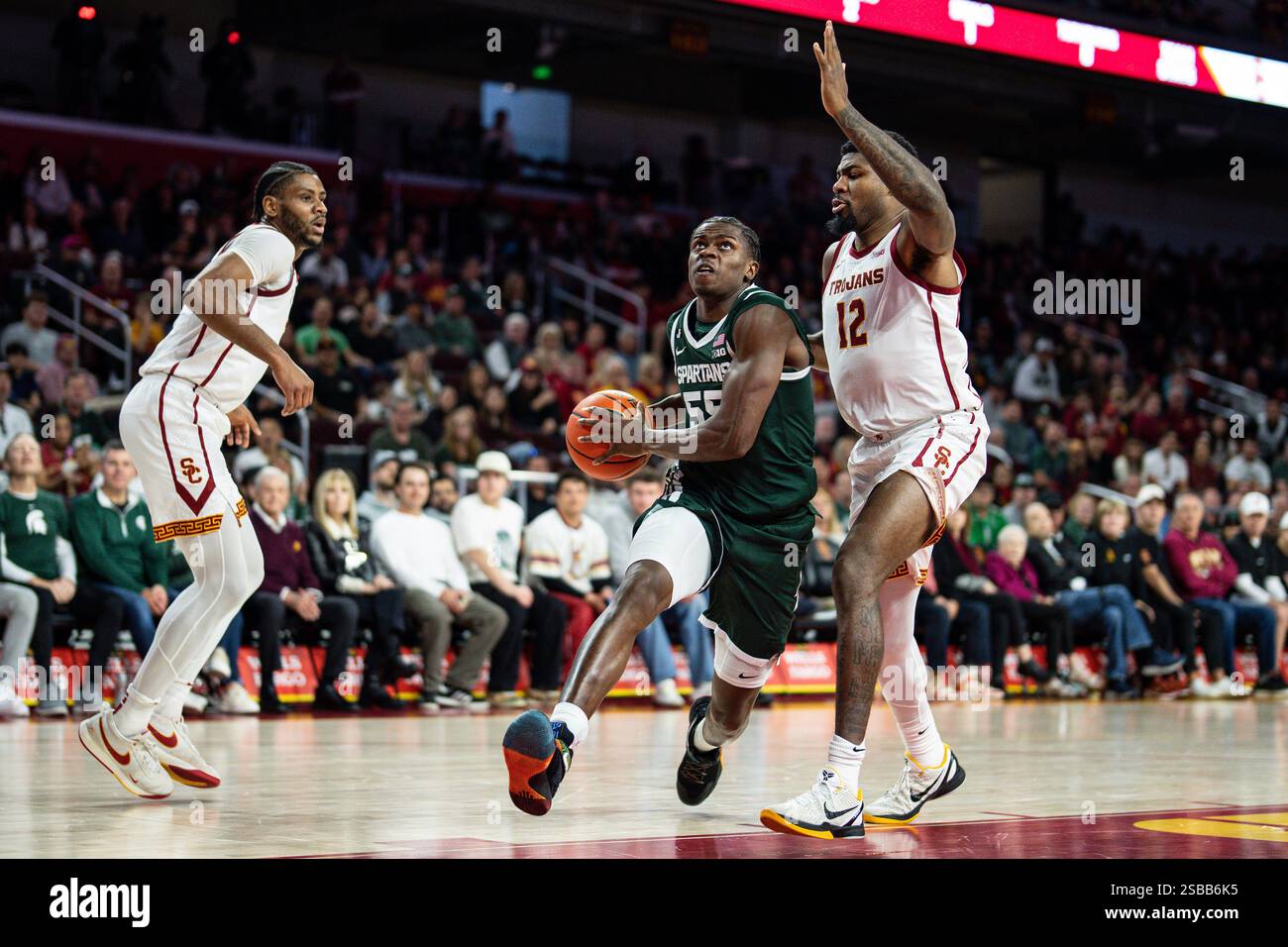 Michigan State Spartans forward Coen Carr (55) drives against USC Trojans forward Rashaun Agee ...