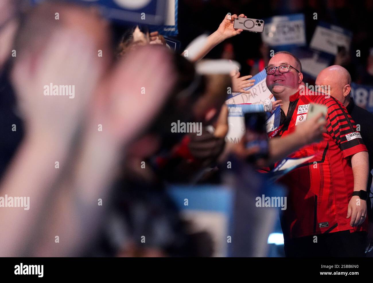 Stephen Bunting walks out ahead of his quarter final match against ...