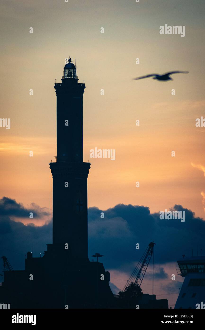 The old Porto Antico of Genoa at the sunset viewing the Lantern of ...