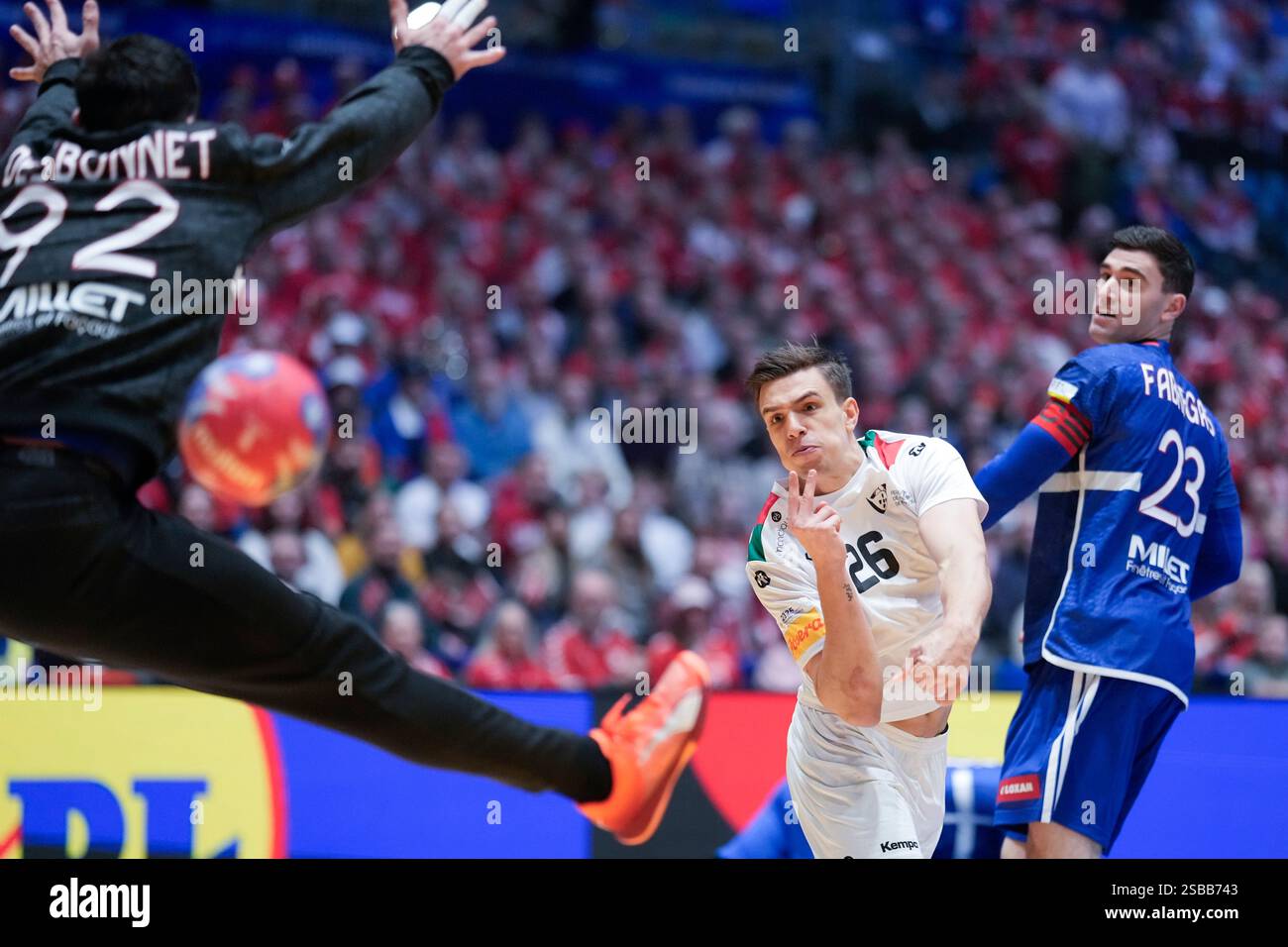 Portugal's Francisco Costa shoots by France's Ludovic Fabregas during ...