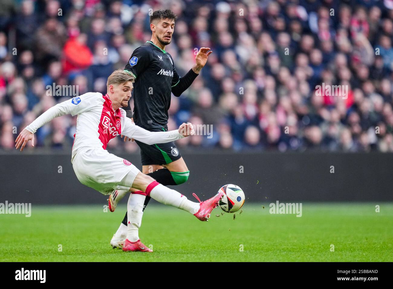 AMSTERDAM, NETHERLANDS - FEBRUARY 2: Kenneth Taylor of AFC Ajax battles ...