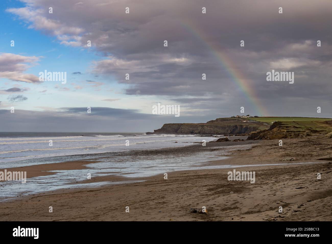 Rainbow hovering over Widemouth Bay in Cornwall Stock Photo - Alamy