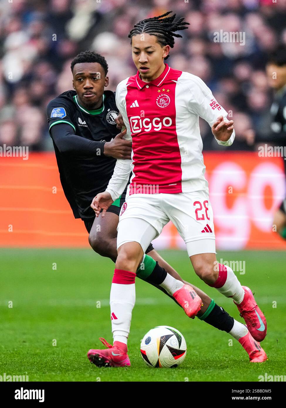 Amsterdam - Antoni Milambo of Feyenoord, Kian Fitz-Jim of Ajax during the twenty-first round of ...