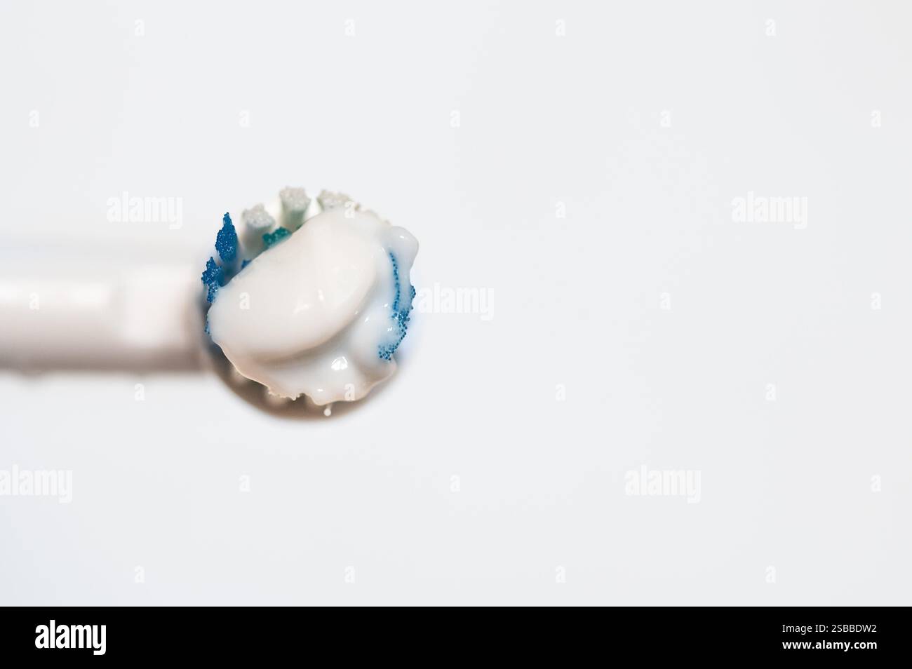 Toothbrush with toothpaste on white background Stock Photo - Alamy
