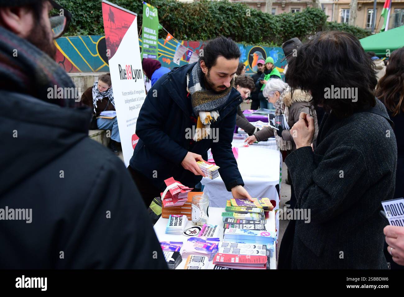 Lyon, France. 01st Feb, 2025. People look at posters on the table ...