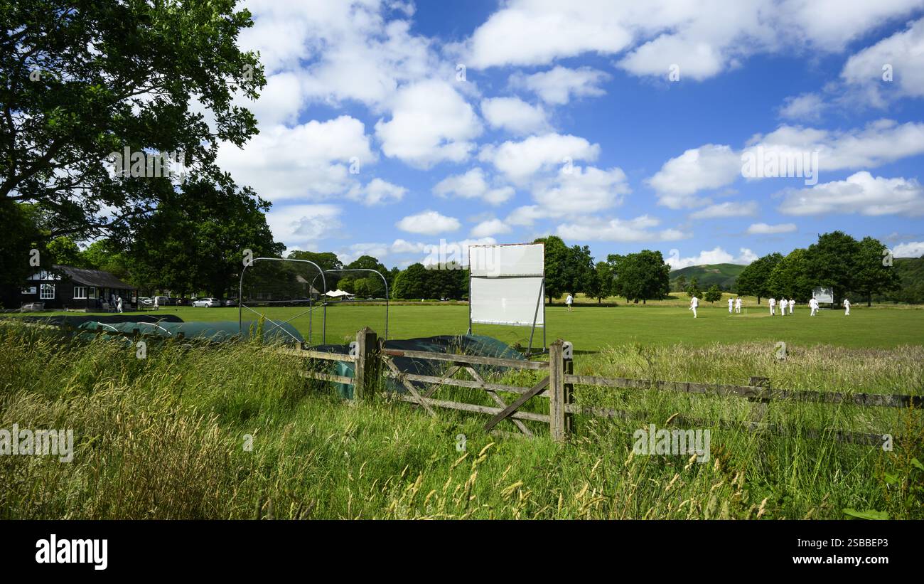 Scenic rural cricket ground (competitive summer sporting fixture ...