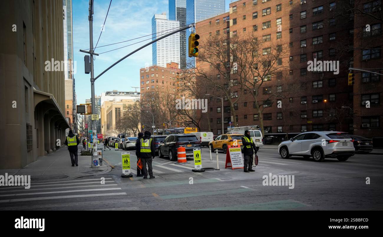 School crossing guards direct traffic in front of the Avenues private ...