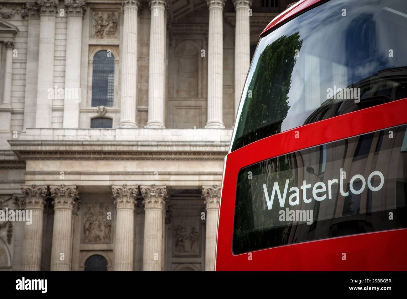 Detail of a red London bus on route to the Waterloo area of London ...