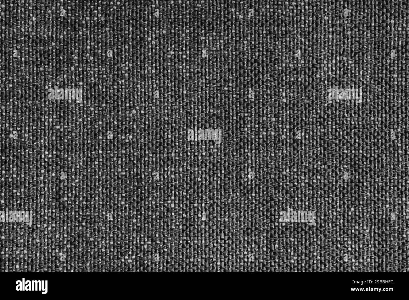 Upholstery black colored jacquard fabric coarse weave texture close up ...