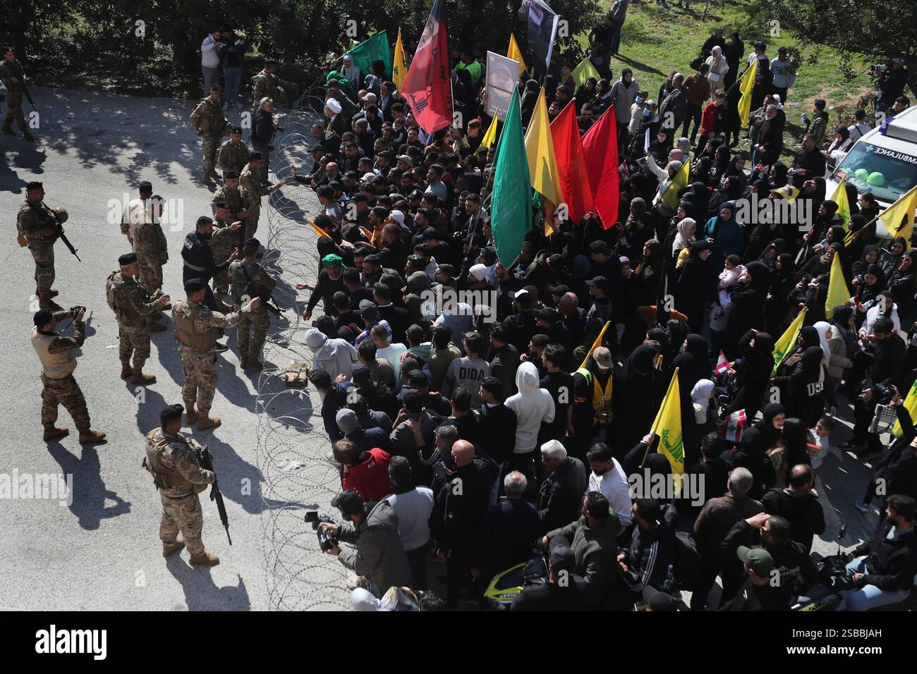 Lebanese citizens gather in front of Lebanese soldiers as they prepare ...