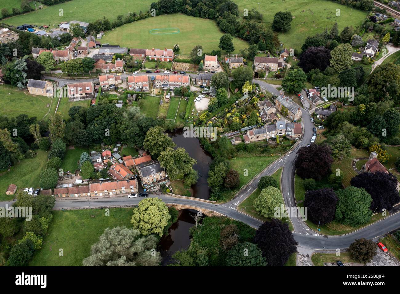 Aerial view Lealholm Village alongside the River Esk, North York Moors ...