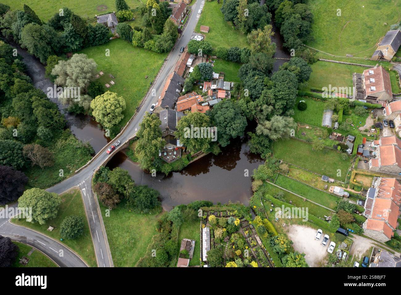 Aerial view Lealholm Village alongside the River Esk, North York Moors ...