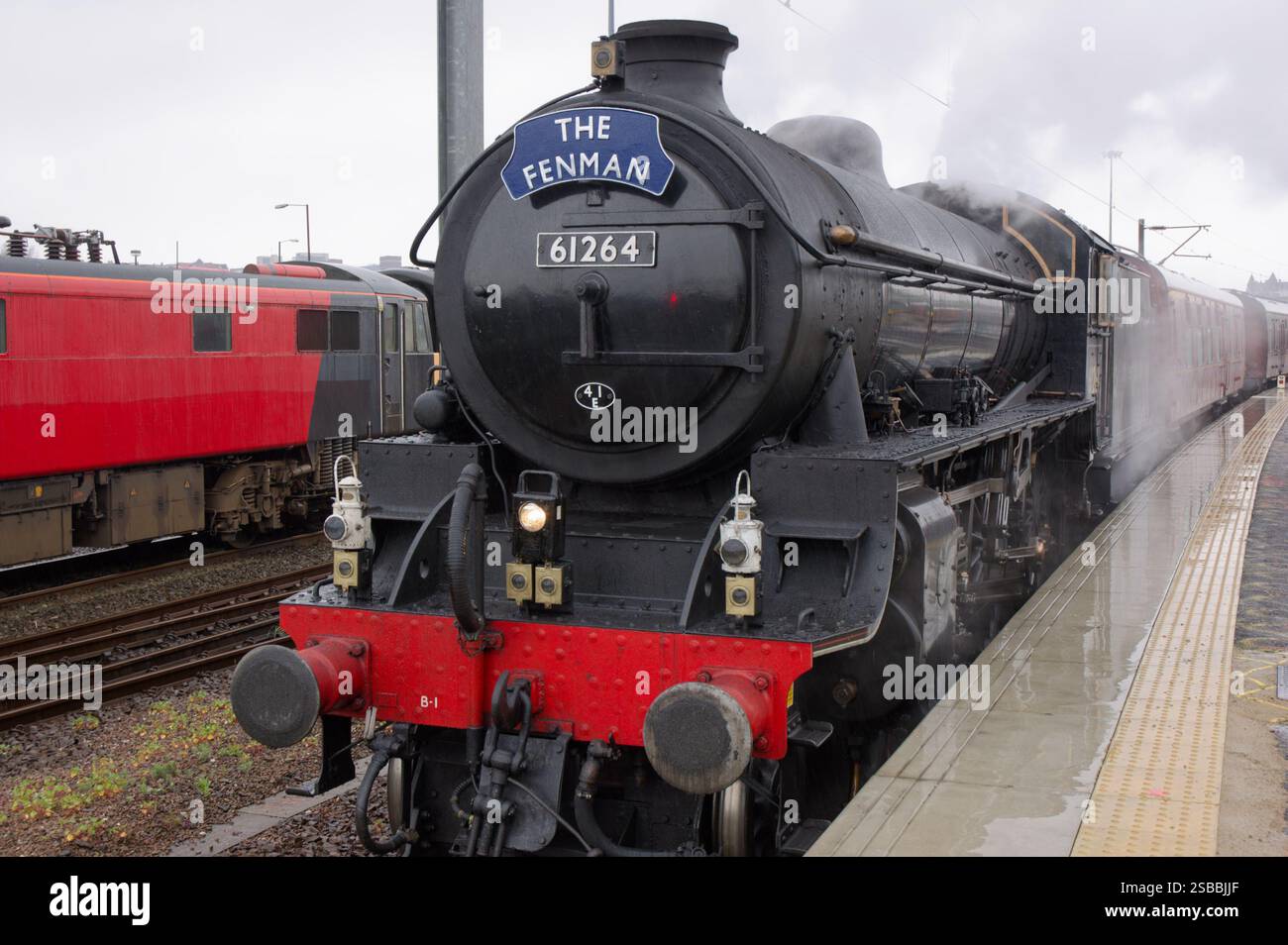 Former LNER class B1 steam locomotive 61264 at a rainy Norwich station ...
