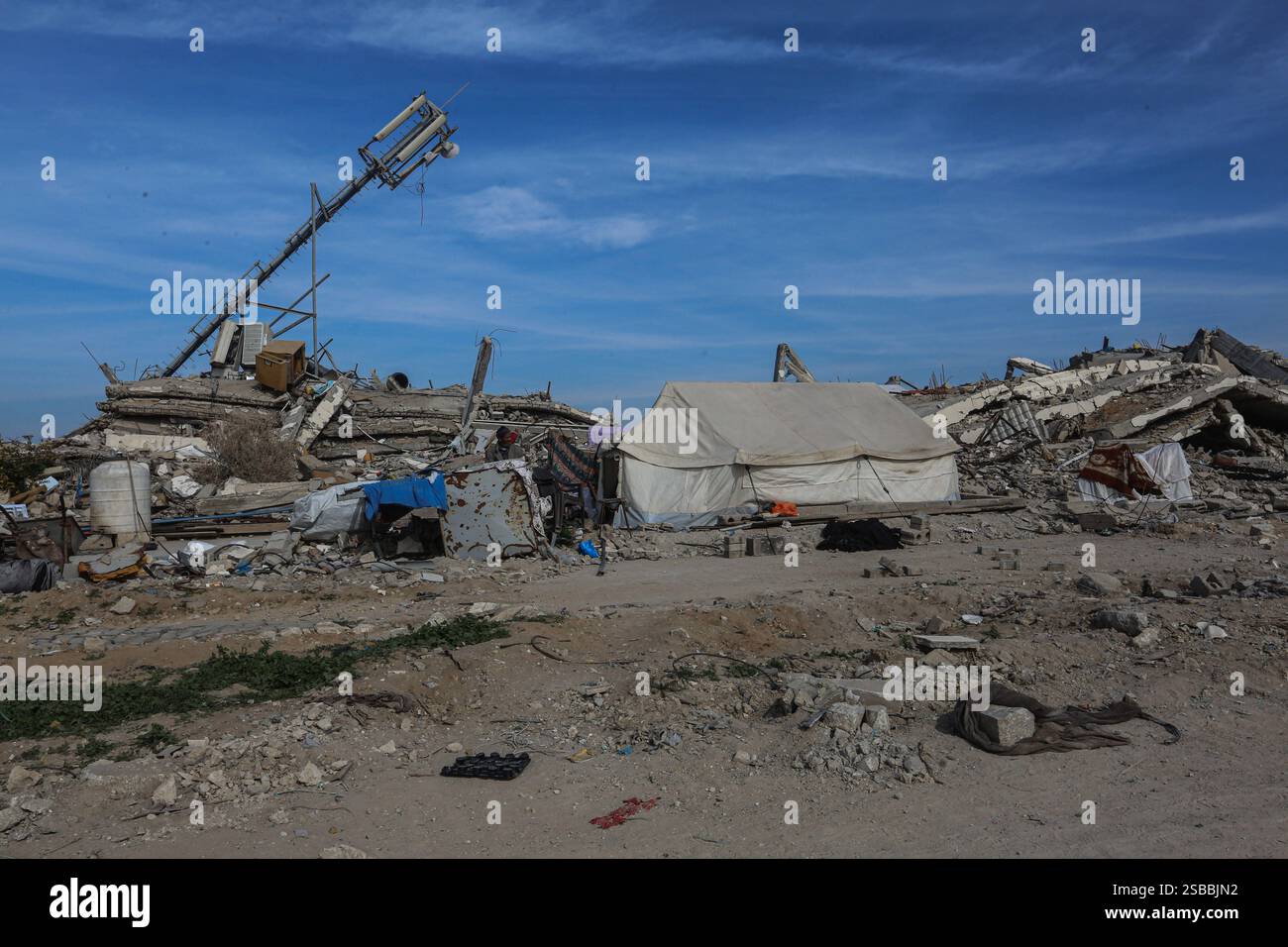 Palestinians try to survive in tents they set up among the debris of ...
