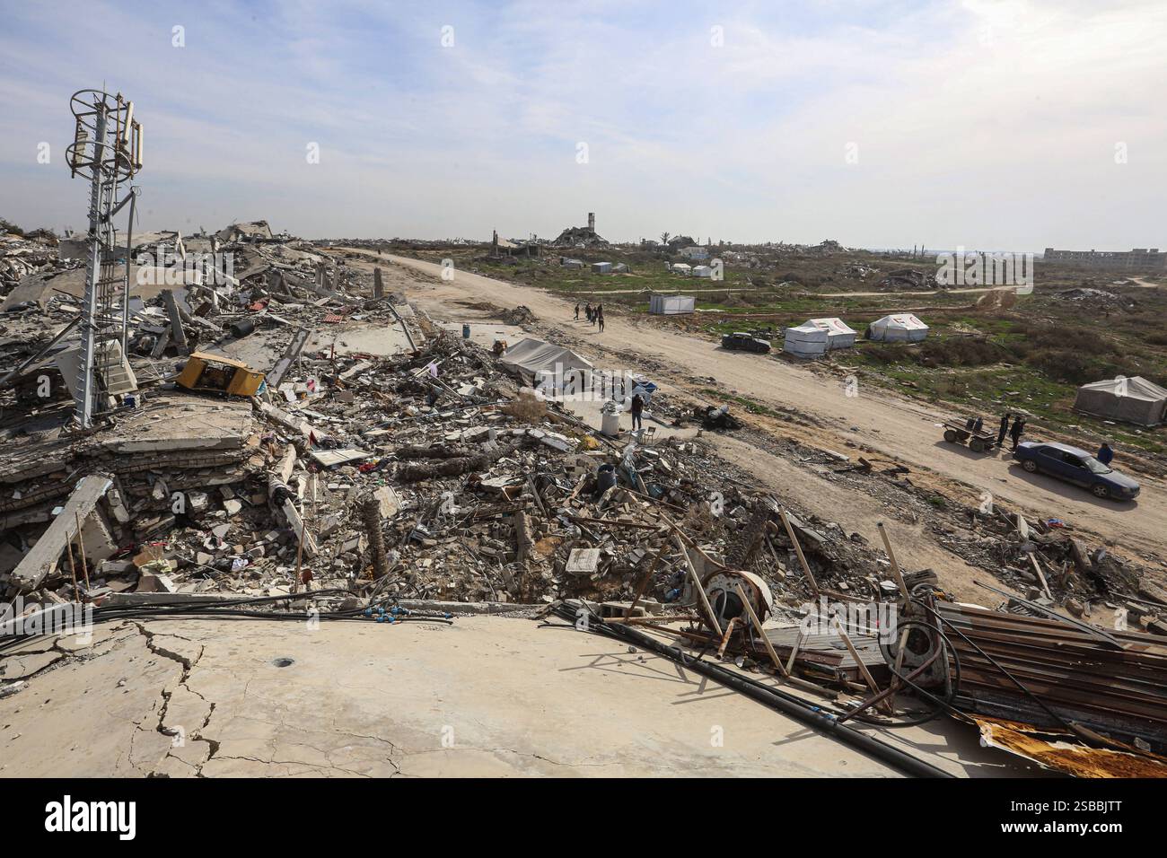 Palestinians try to survive in tents they set up among the debris of ...