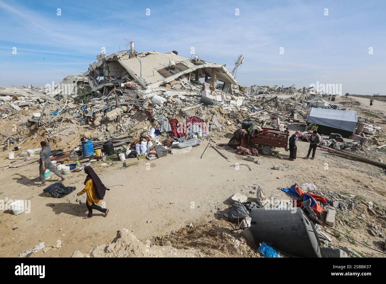 Palestinians try to survive in tents they set up among the debris of ...