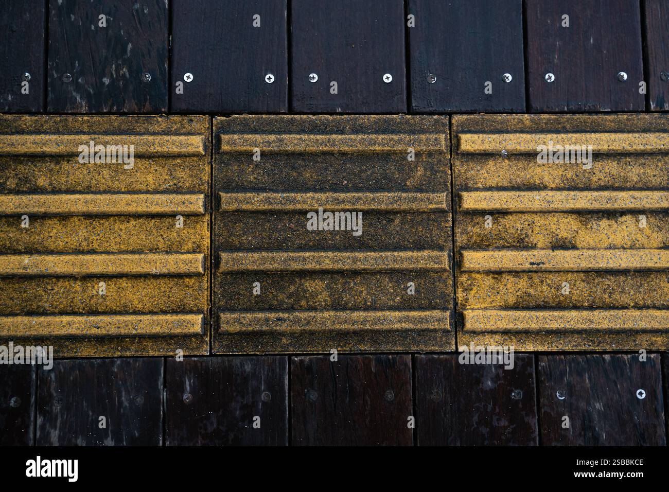 a Top view of textured yellow Braille block, tactile paving for blind ...