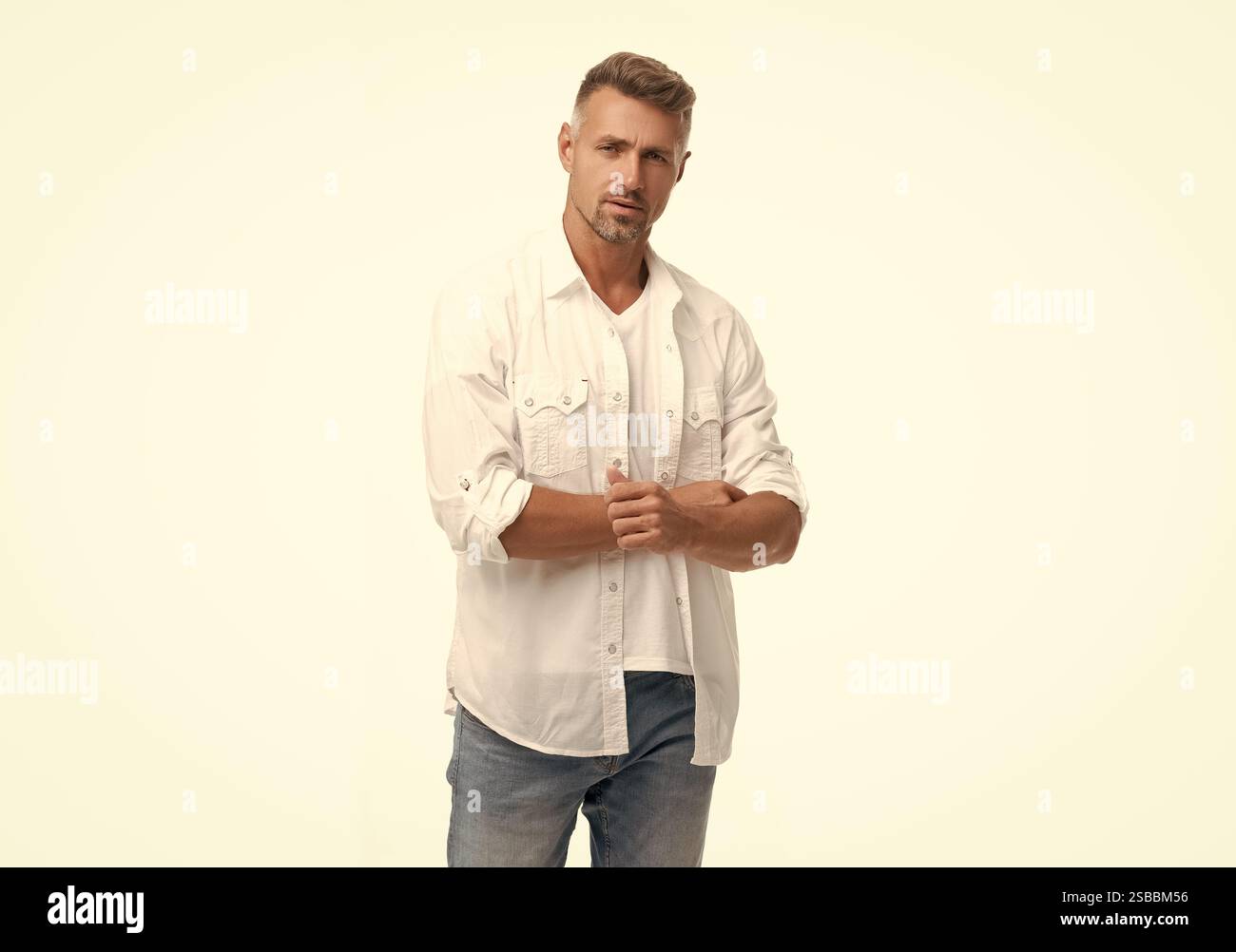 serious grizzled man in white shirt. grizzled man style. studio shot of ...