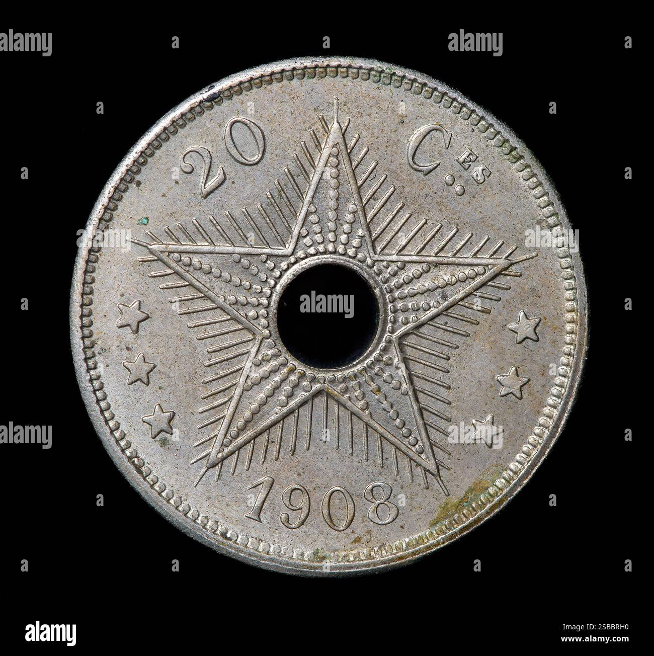 A vintage 20 centavos coin from 1908 displays an intricate star design ...