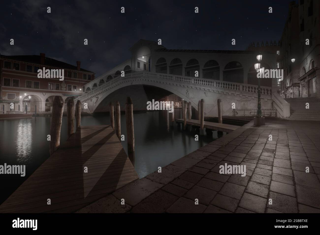 A mesmerizing nighttime view of the iconic Rialto Bridge in Venice ...