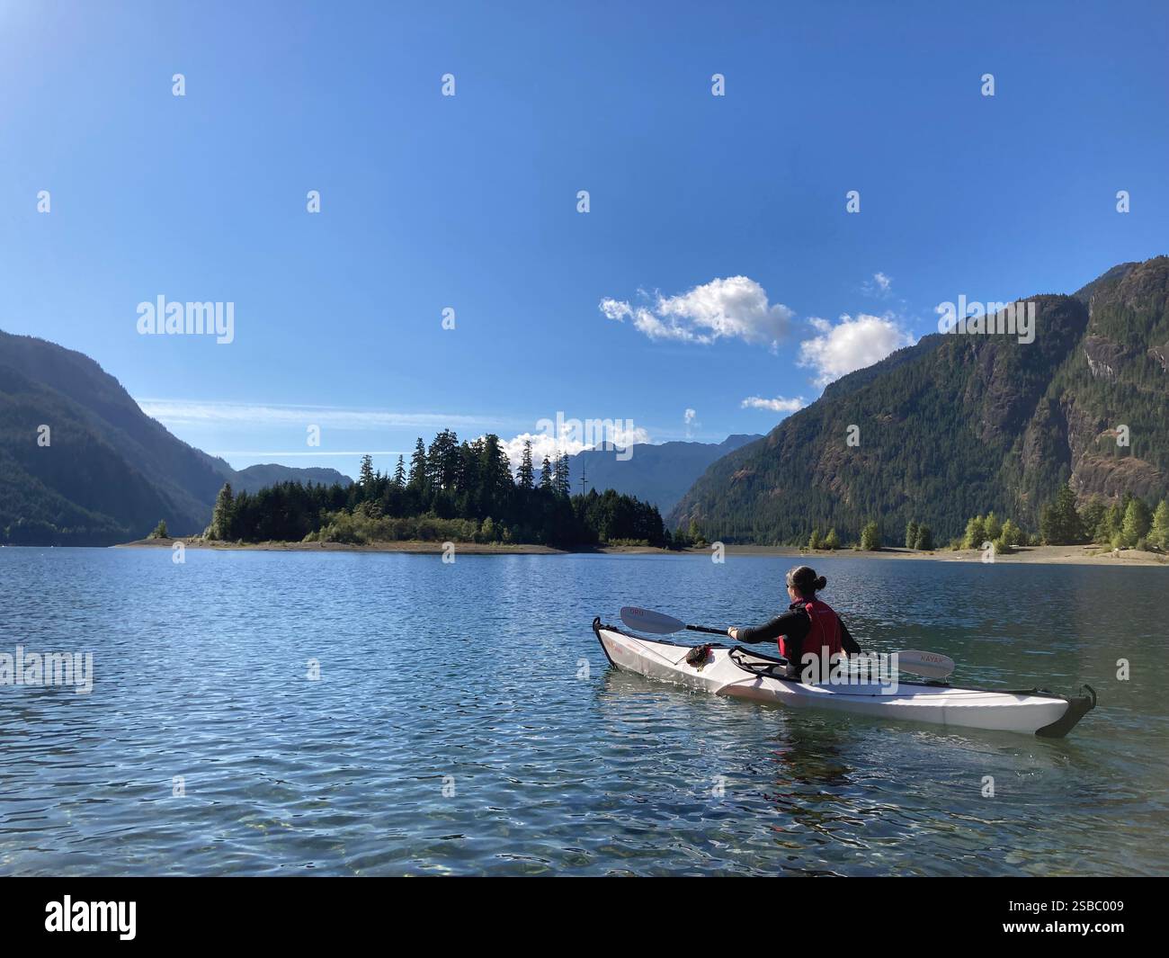 Woman in kayak on Buttle Lake, Strathcona Provincial Park, Vancouver ...