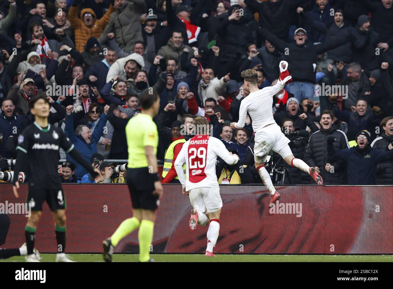 AMSTERDAM - (l-r) Inbeom Hwang of Feyenoord balks, Christian Rasmussen of Ajax, Kenneth Taylor ...
