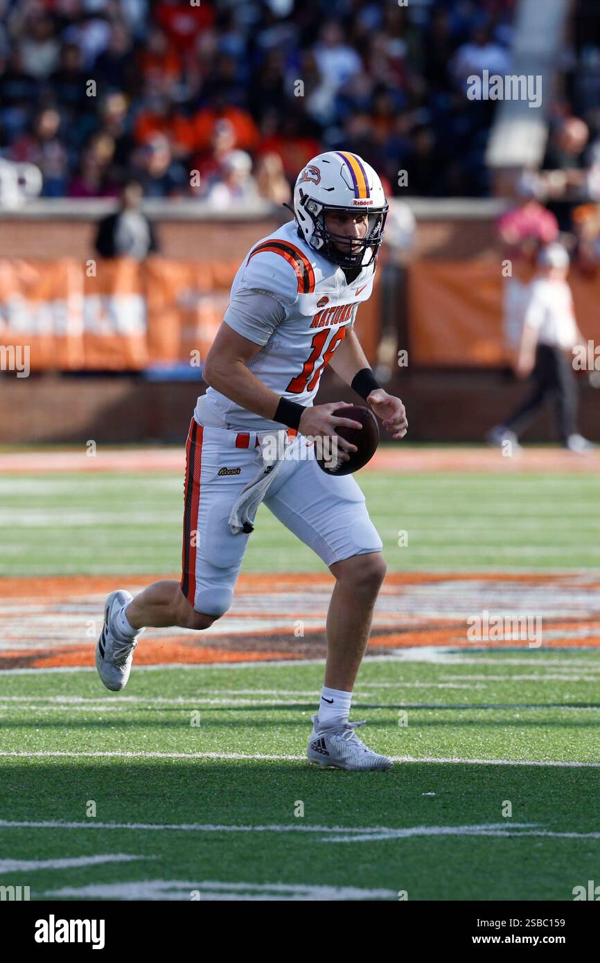 National team quarterback Taylor Elgersma (18), of Laurier, scrambles ...