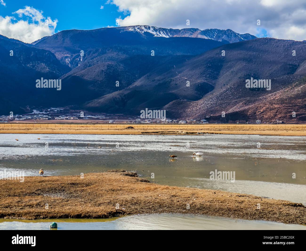 Napahai Grassland Scenic Area And Napahai Lake Surrounded by Snow ...