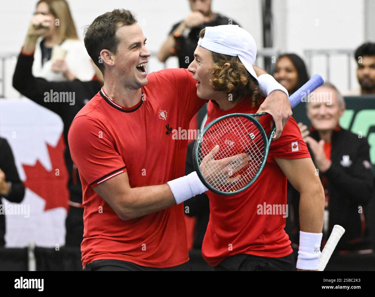 Liam Draxl and Vasek Pospisil, of Canada, react during their Davis Cup ...