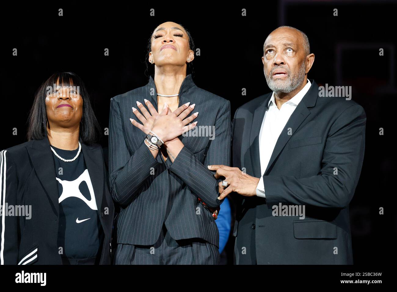 Las Vegas Aces' A'ja Wilson, center, stands with her parents Eva, left ...
